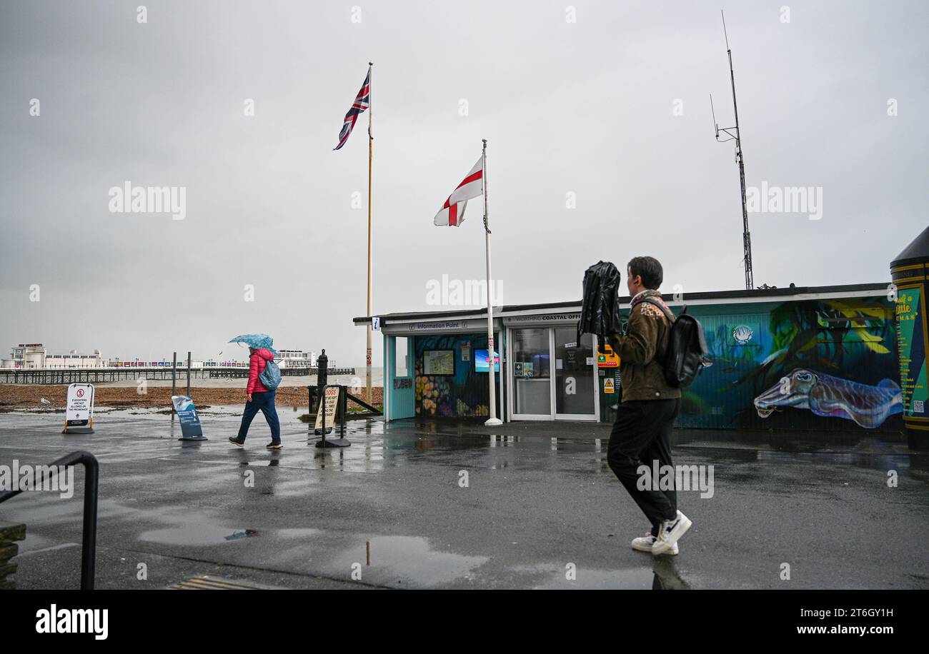 Worthing UK 10th November 2023 - Walkers on Worthing seafront in the ...