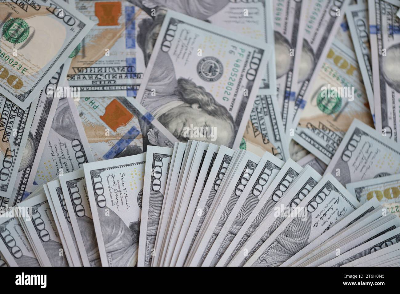 Very big amount of US hundred dollar bills close up. Huge quantity of ...