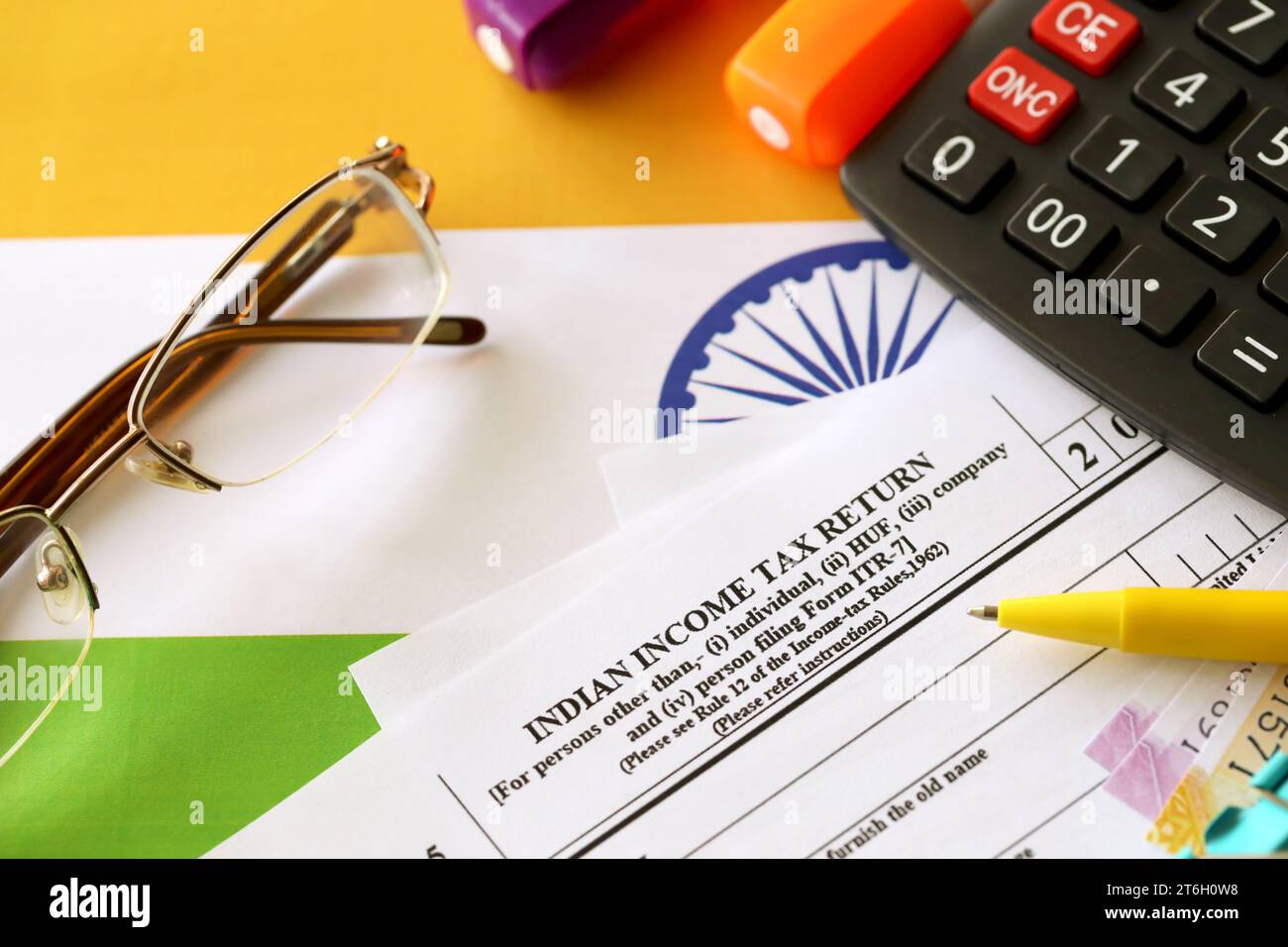 Indian income tax return blank form with pen and indian rupees bills on ...