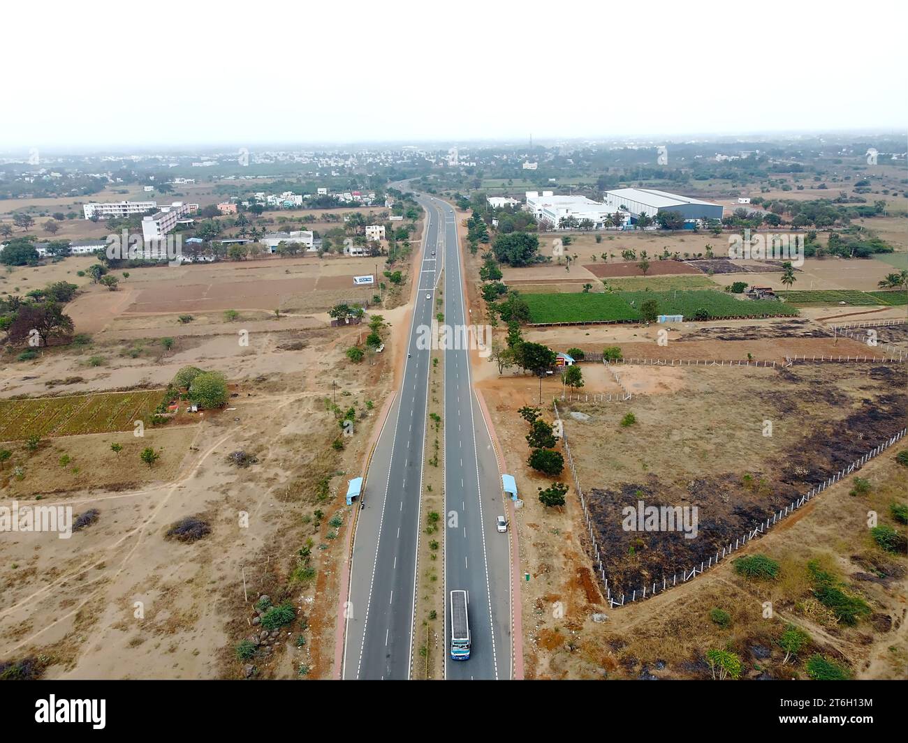 Bright aerial picture of highway in a desert Stock Photo - Alamy