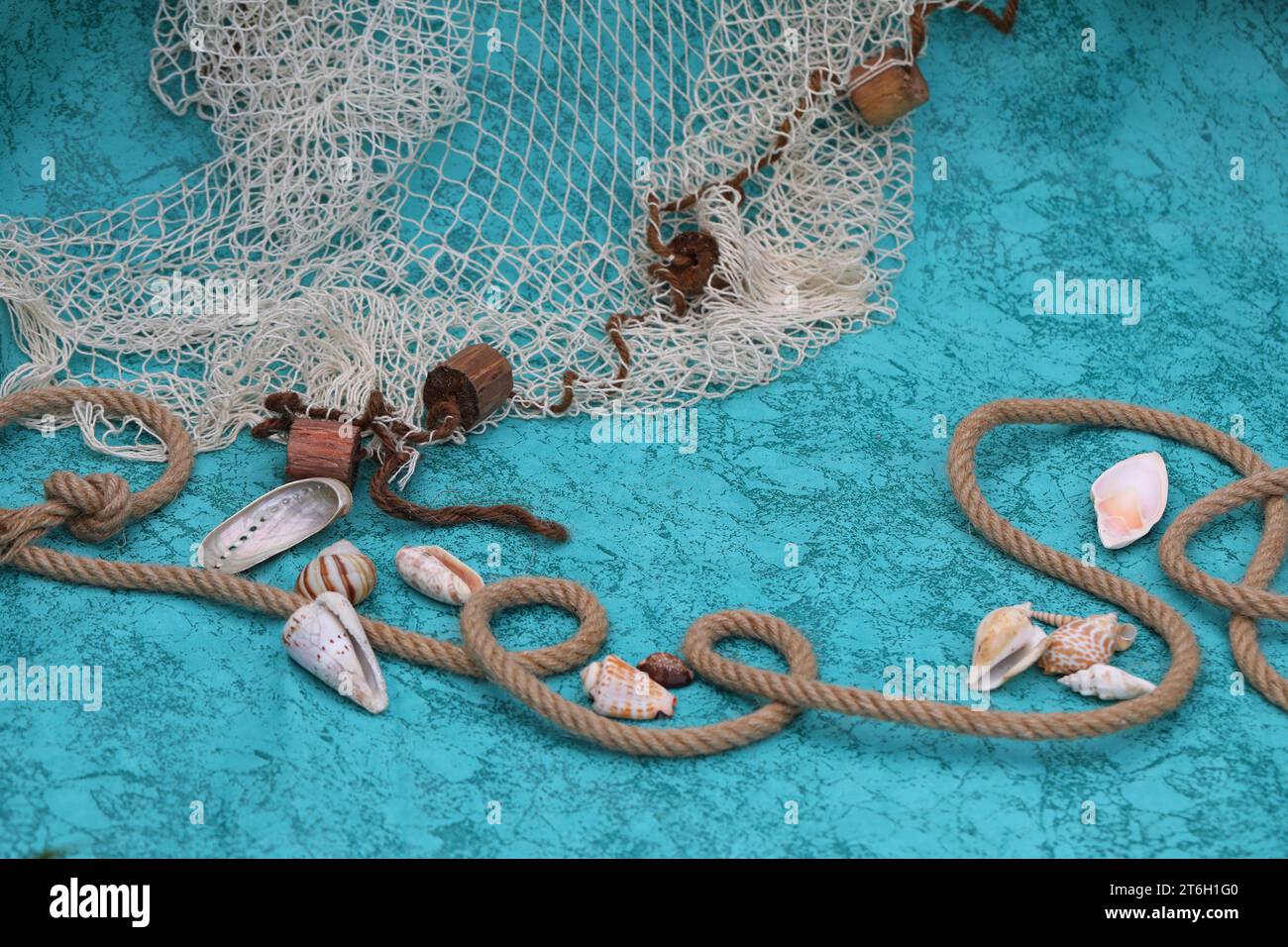 Deep blue background with shells, rope and fishnet Stock Photo - Alamy