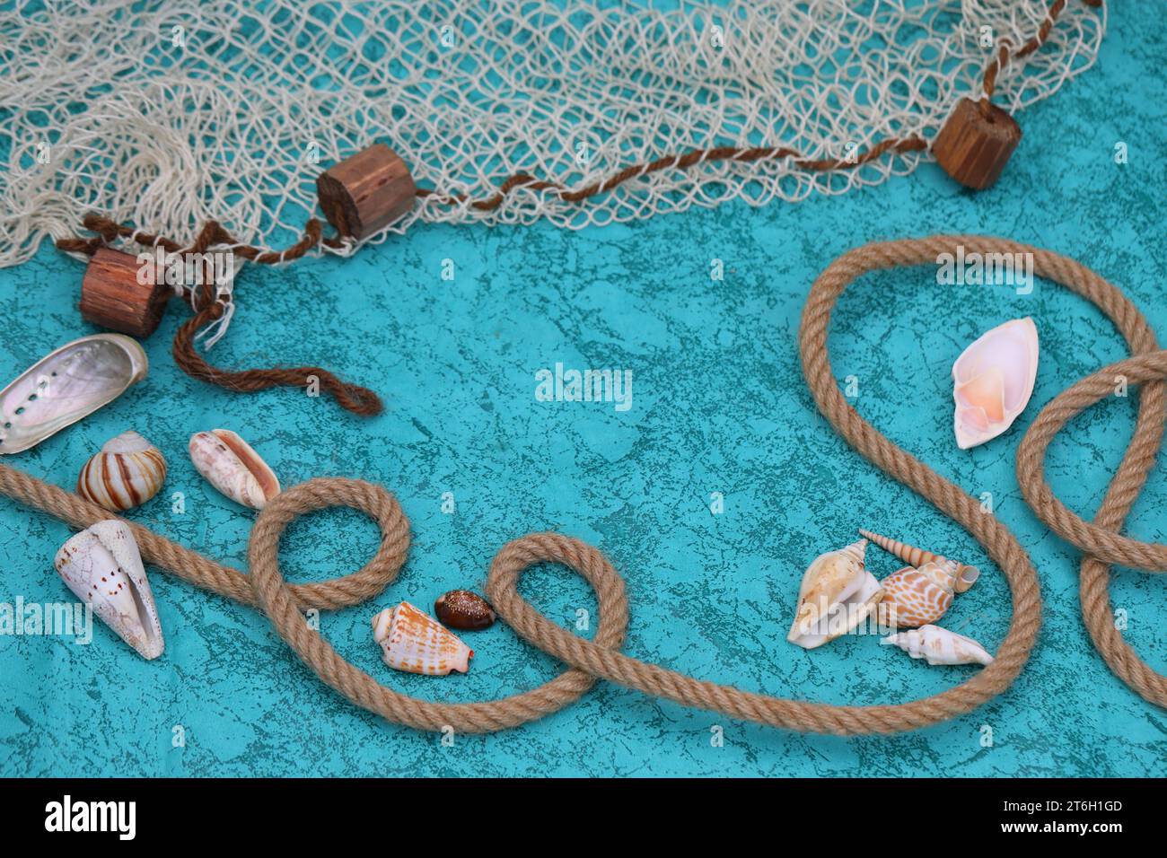 Deep blue background with shells, rope and fishnet Stock Photo - Alamy