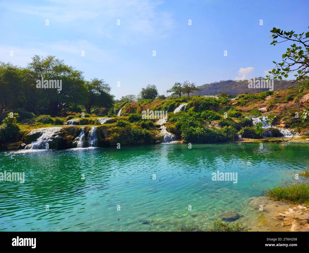 A beautiful waterfall in an oasis of Oman. Wadi Darbat Stock Photo - Alamy