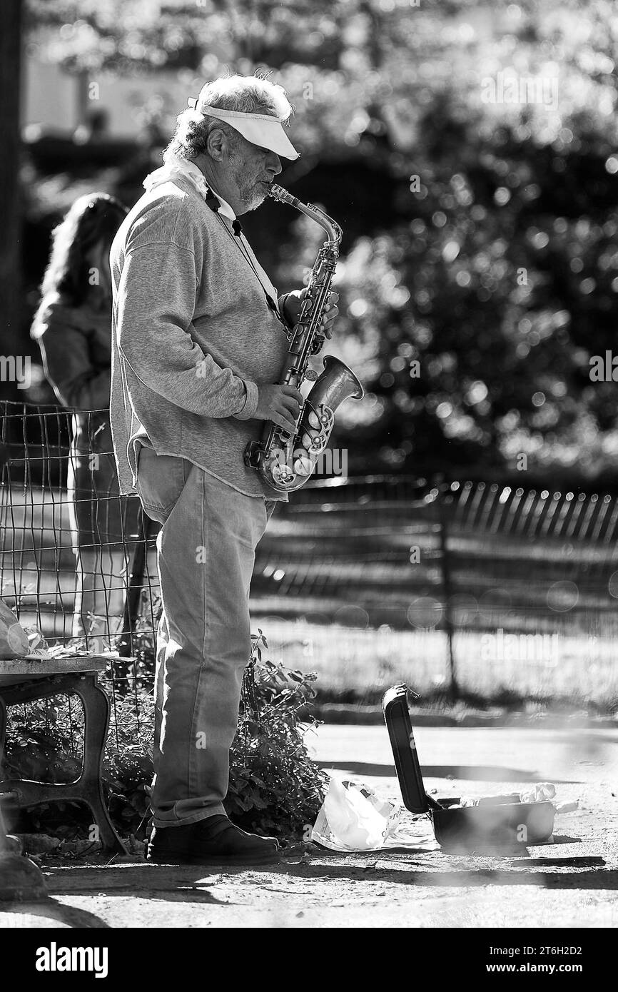 Black And White Photo Of A Man Playing The Saxaphone (Busking) In ...