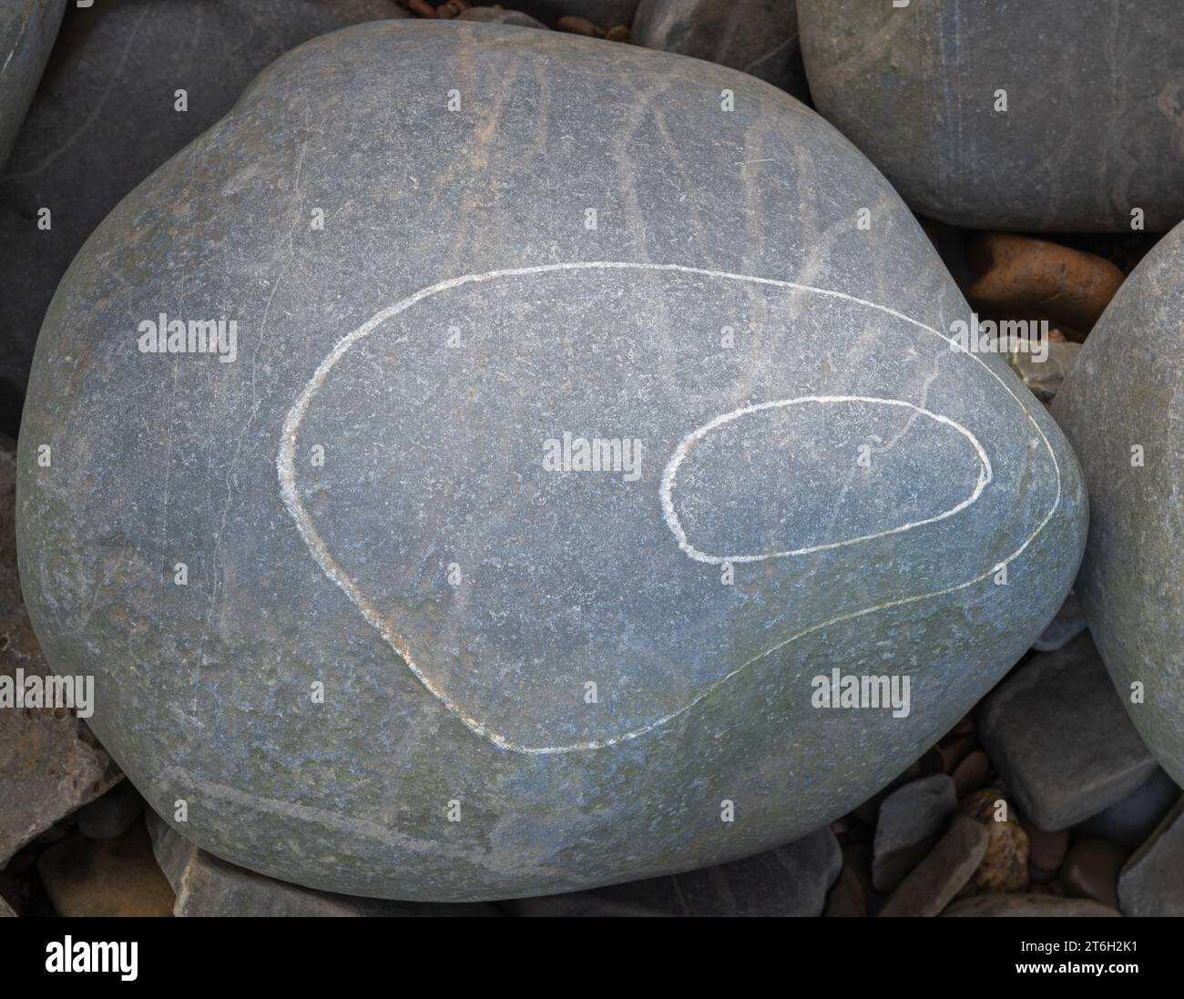 Patterns in the rock boulders on the beach taken at low tide near ...