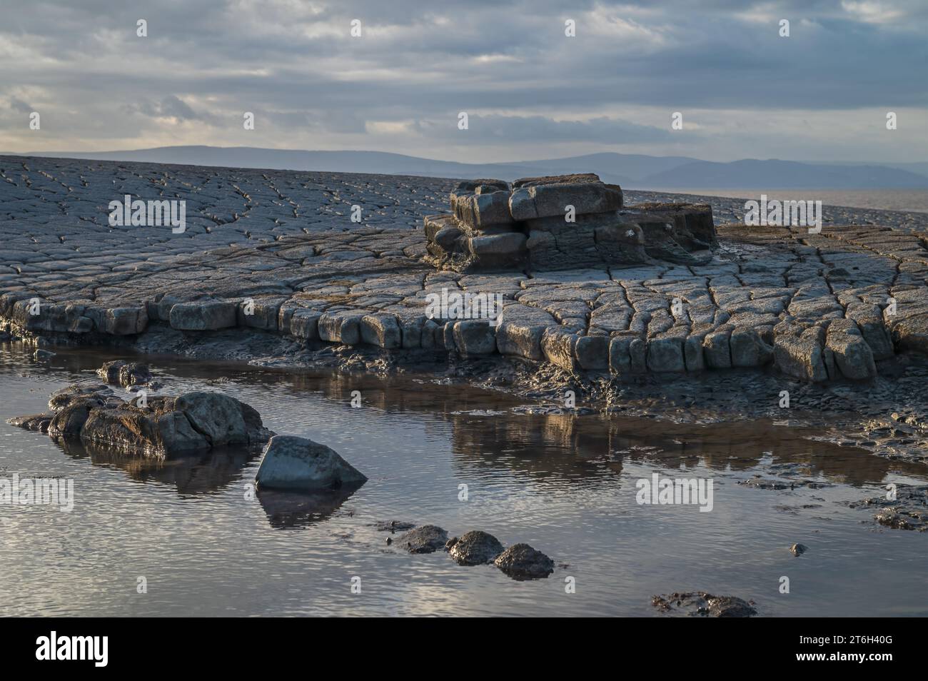 Limestone pavements and boulders exposed at low tide on Somerset Coast ...
