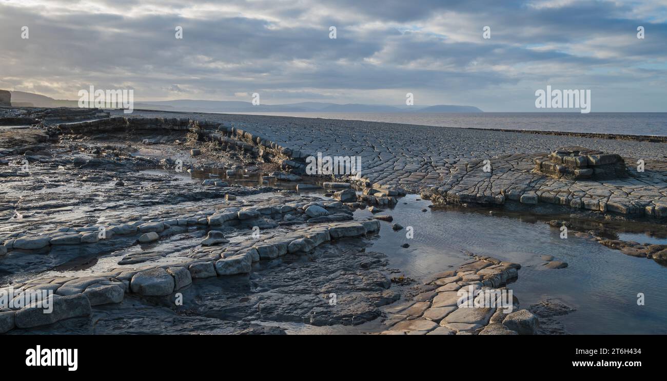 Limestone pavements and boulders exposed at low tide on Somerset Coast ...