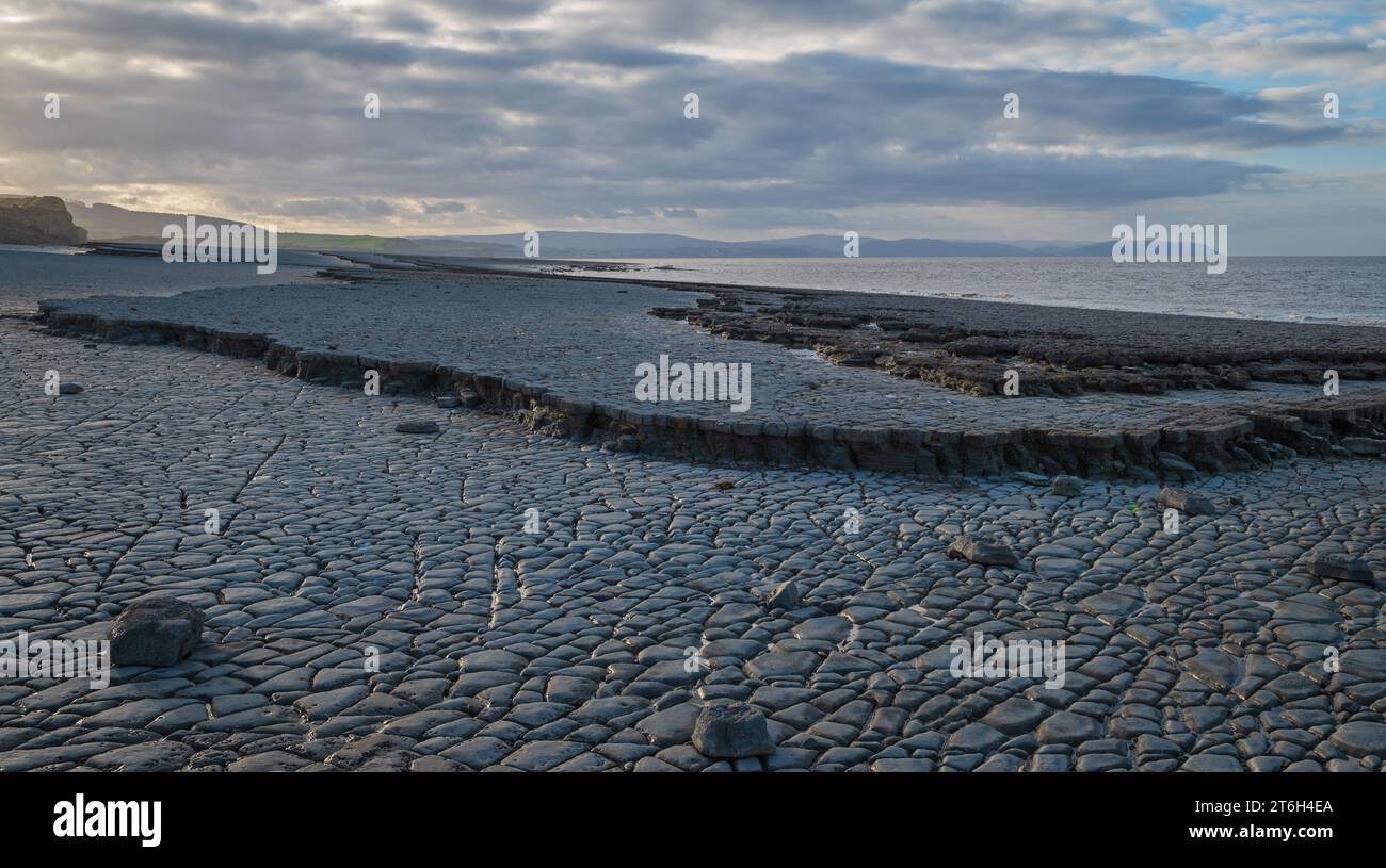 Limestone pavements and boulders exposed at low tide on Somerset Coast ...