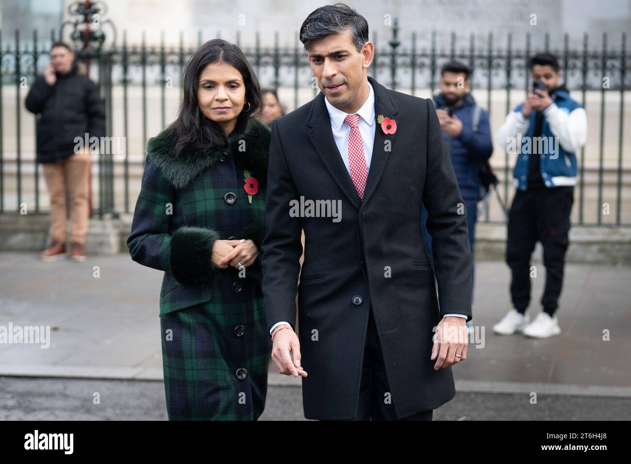 Prime Minister Rishi Sunak and his wife Akshata Murty leave after visiting the Field of ...