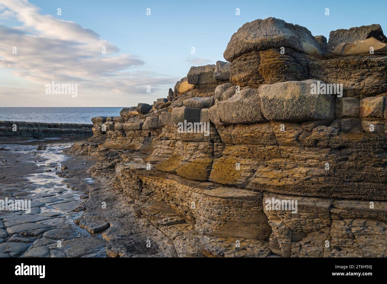 Limestone pavements and boulders exposed at low tide on Somerset Coast ...