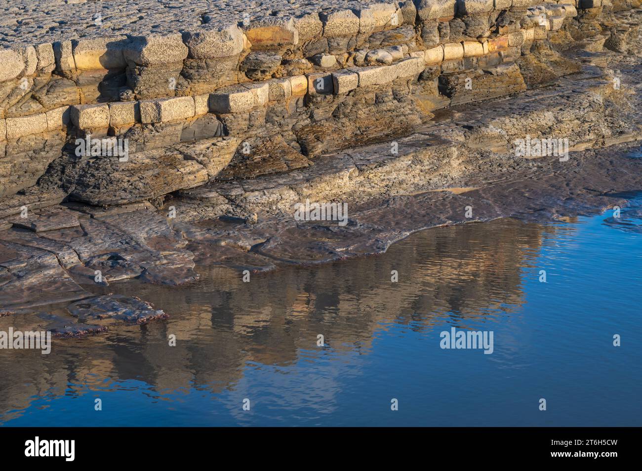 Limestone pavements and boulders exposed at low tide on Somerset Coast ...