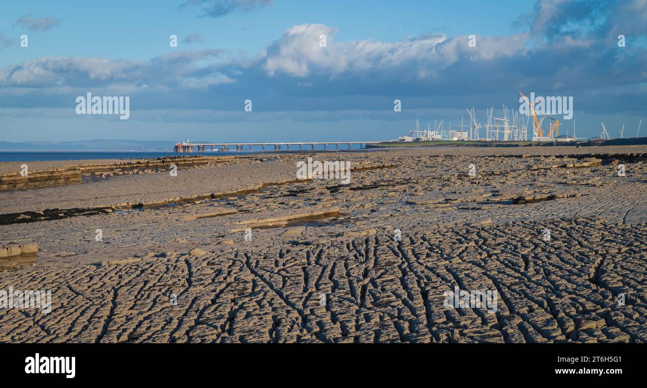 Hinkley Point construction site behind Limestone pavements and boulders ...