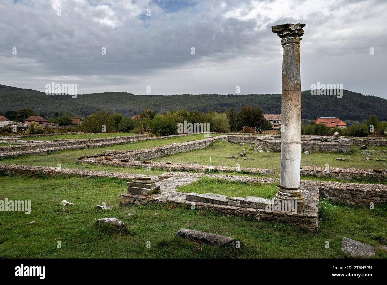 This image depicts a stone structure with several columns, providing an ... This image depicts a stone structure with several columns, providing an ...