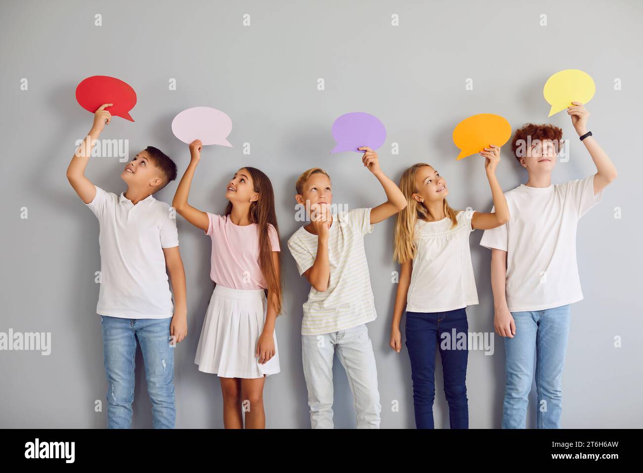 Group of children expressing their opinions using speech bubbles and ...