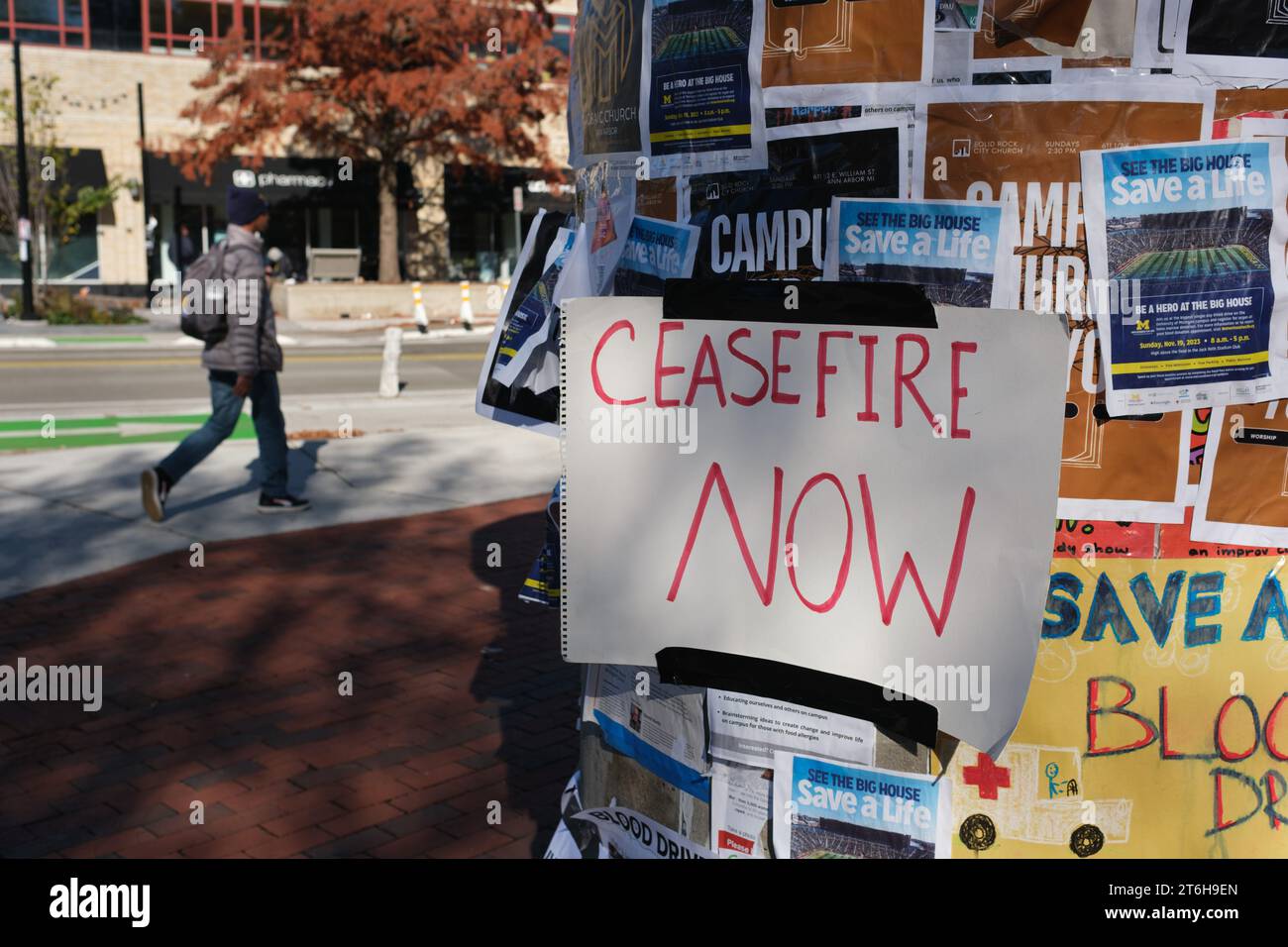 Ceasefire Now handwritten sign on a kiosk in downtown Ann Arbor ...