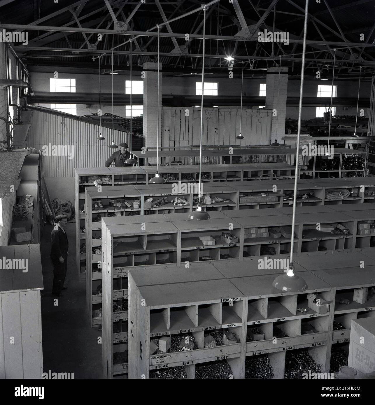1950s, historical, overhead view of a spare parts depot at steelworks ...