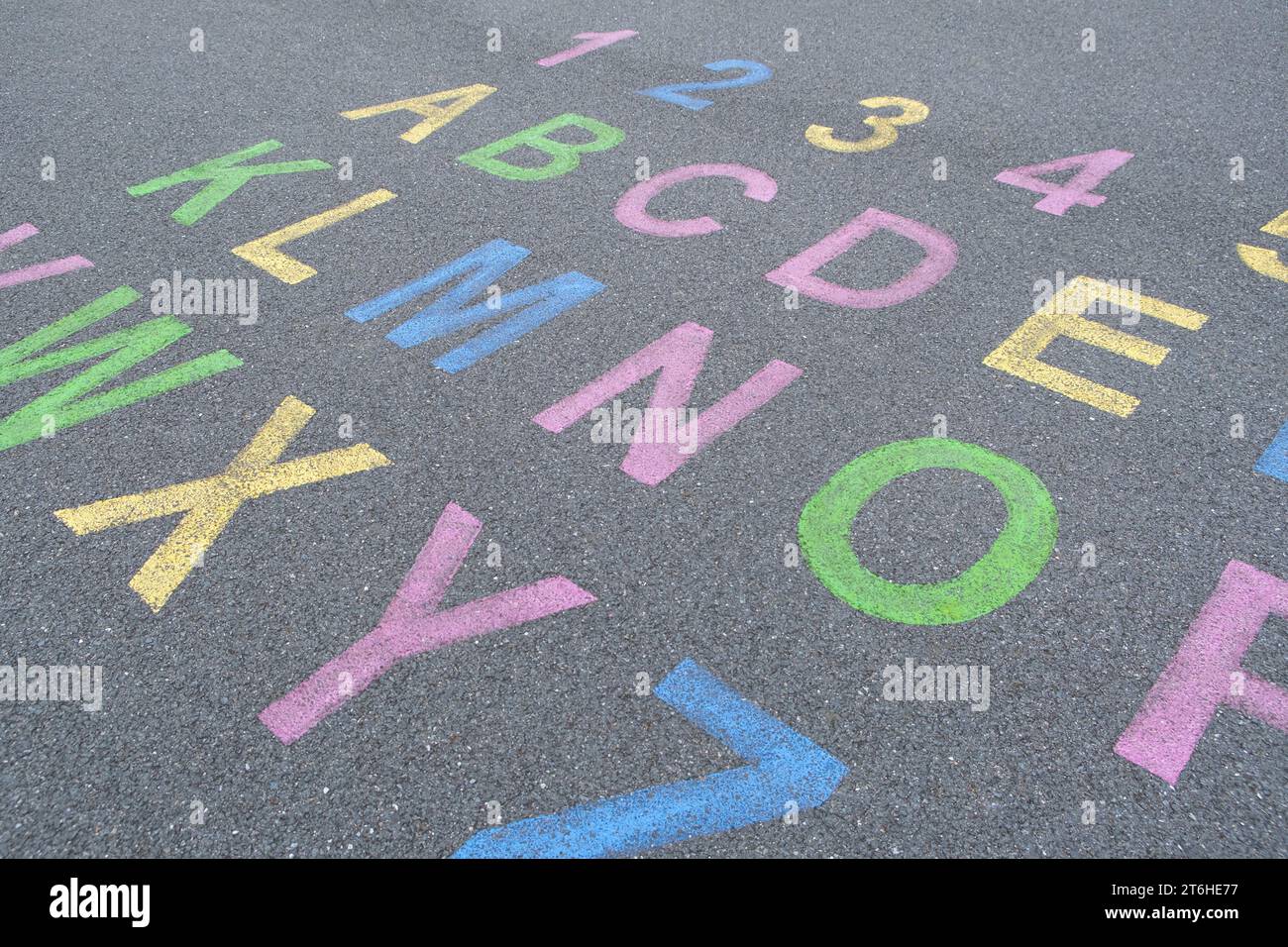 the alphabet and numbers are drawn with color paint on a children's ...