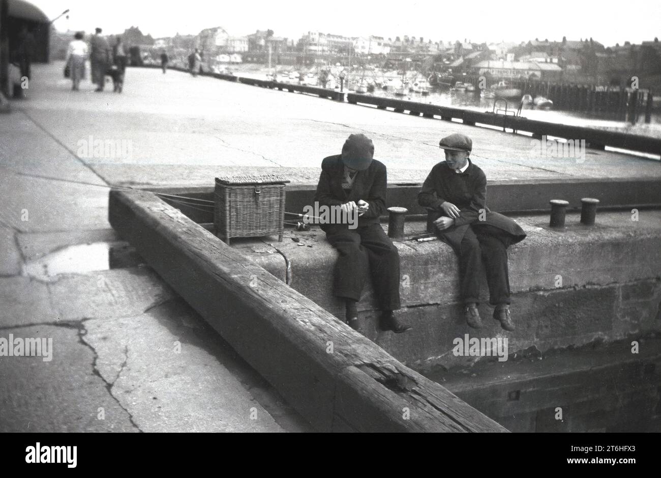 1950s, historical, two schoolboys wearing flat caps, common headwear ...