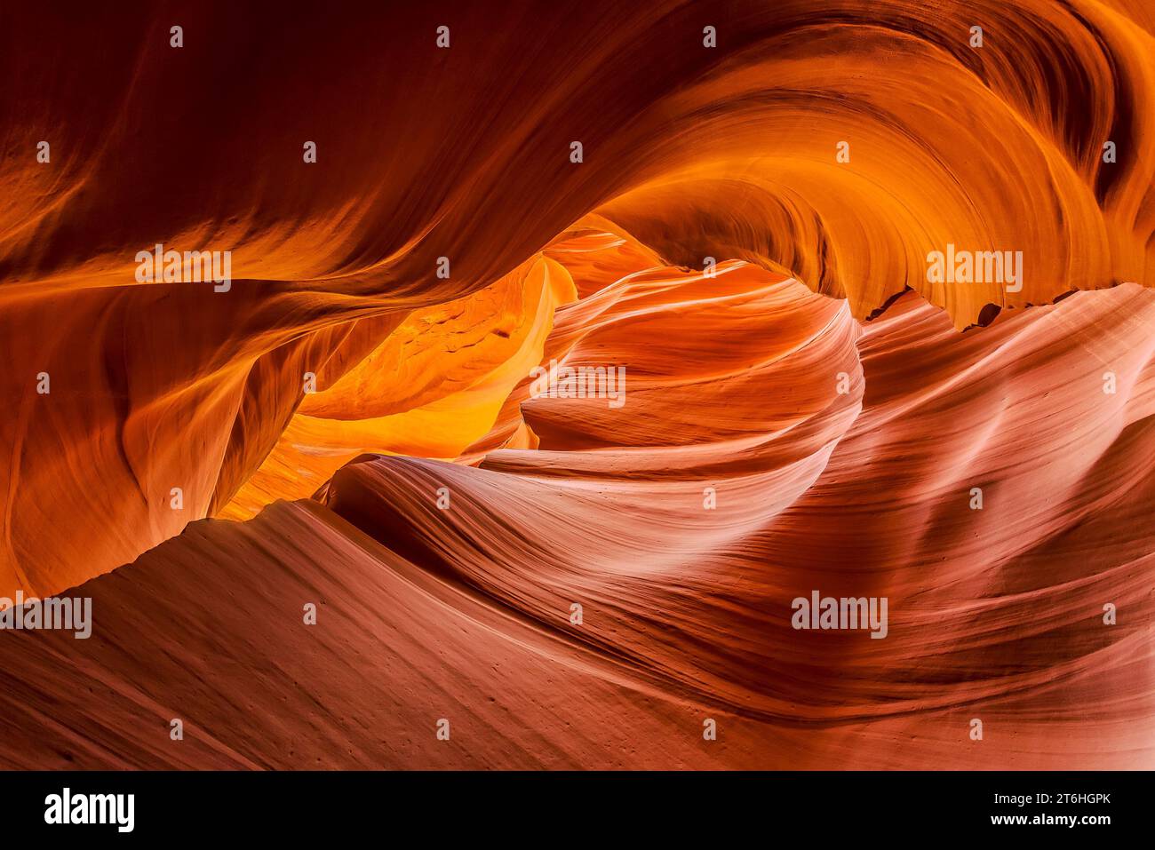 A spiral of rock striations stretches skyward in lower Antelope Canyon ...