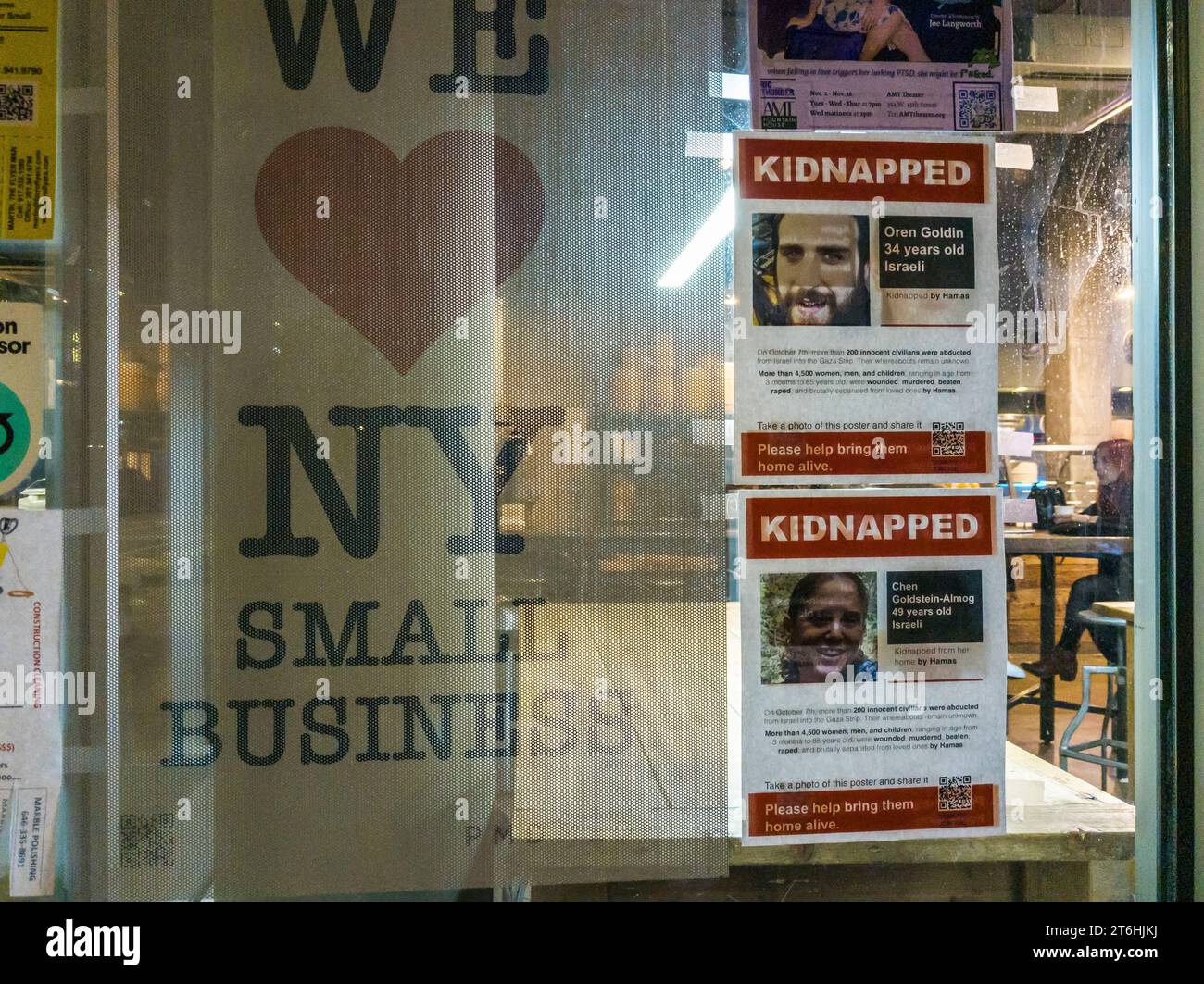Kidnapped flyers are seen posted on the window of a coffee shop in the ...