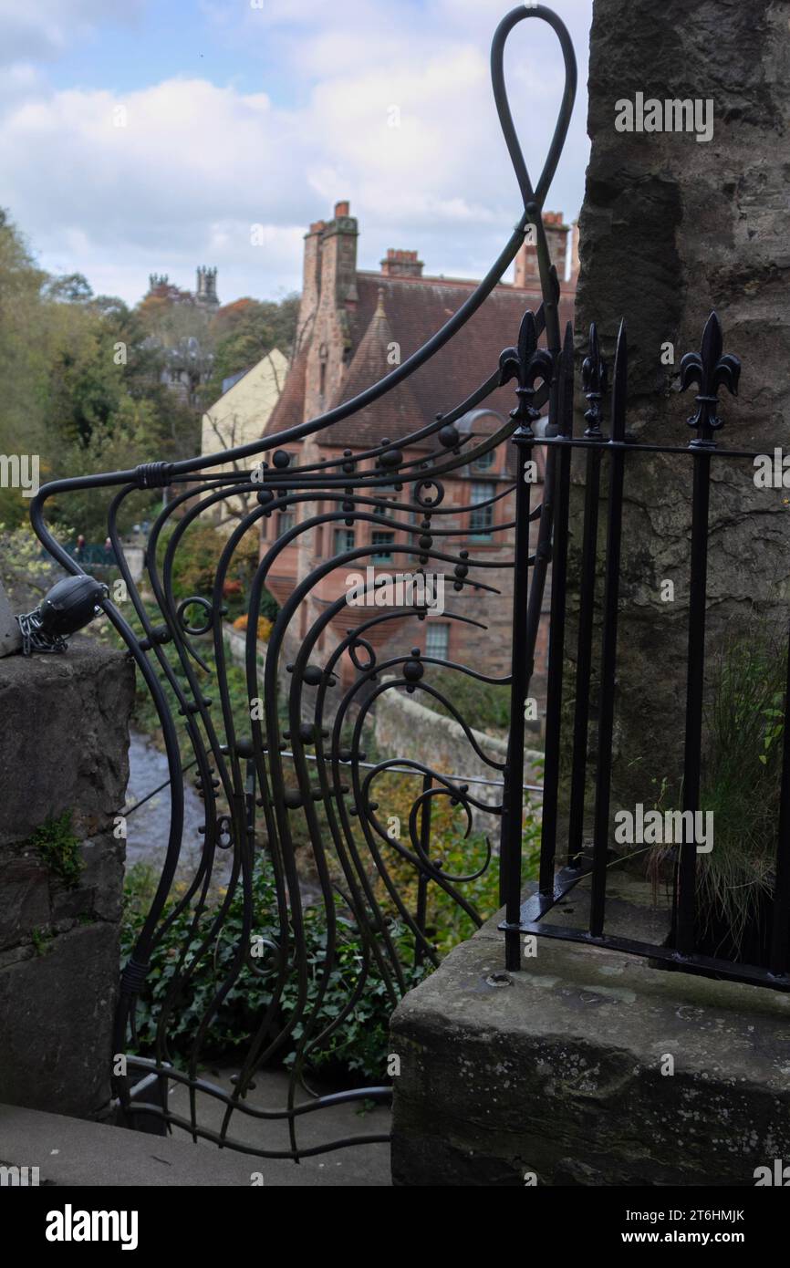 Edinburgh: a view through the swirls of a modern wrought-iron gate made ...