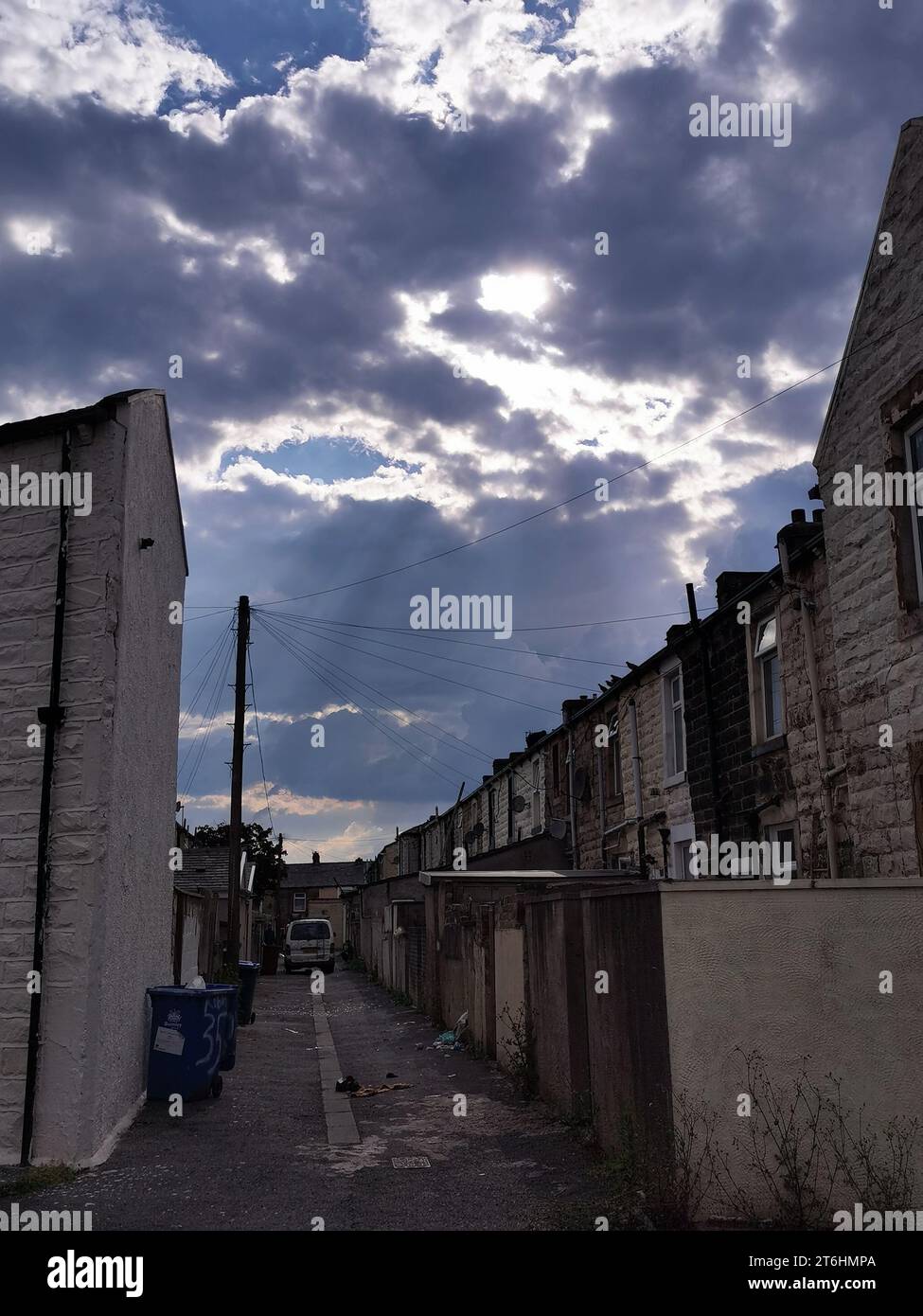 A picturesque suburban street with two-story houses on either side ...