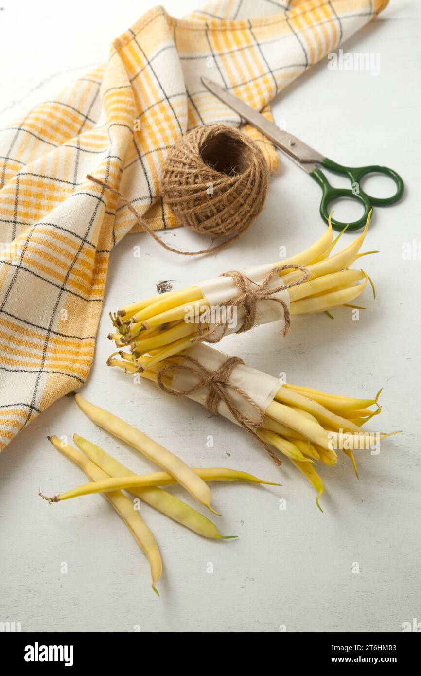 Several pods and two bunch of raw yellow pods of haricot with yellow ...