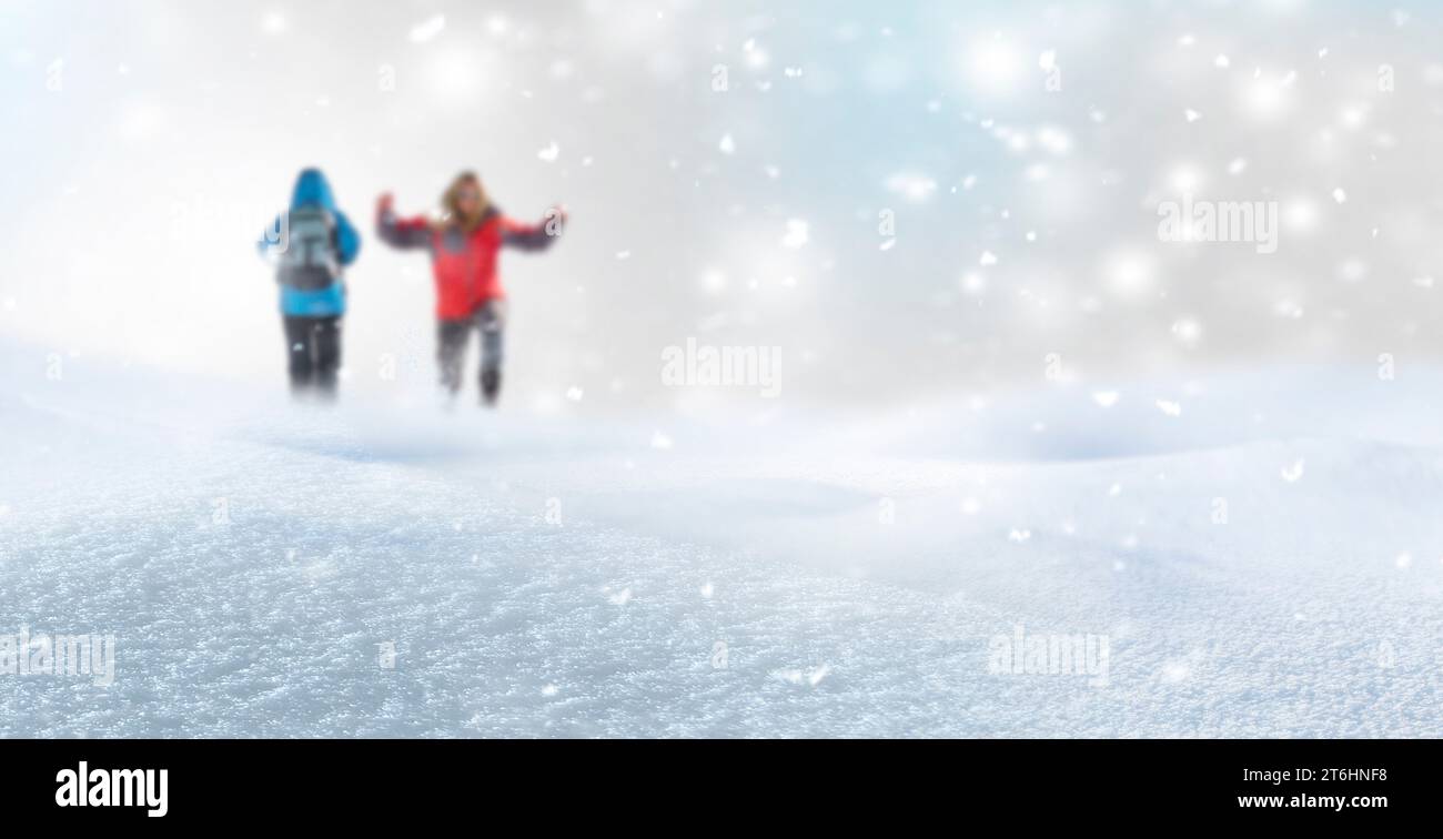 Blurred winter background with two people in snow Stock Photo - Alamy