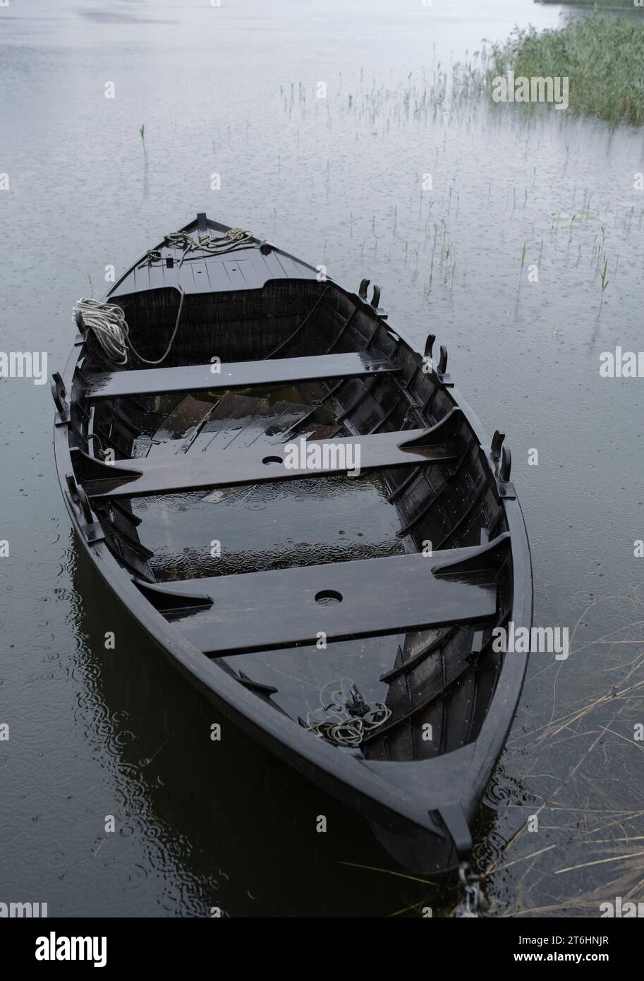 rowing boat in rain Stock Photo - Alamy