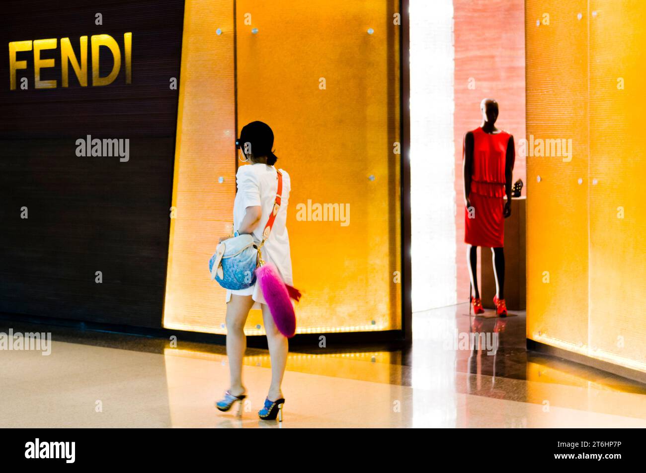 China, Shanghai, Mall Plaza 66 in Nanjing Lu, Chinese woman walks past ...
