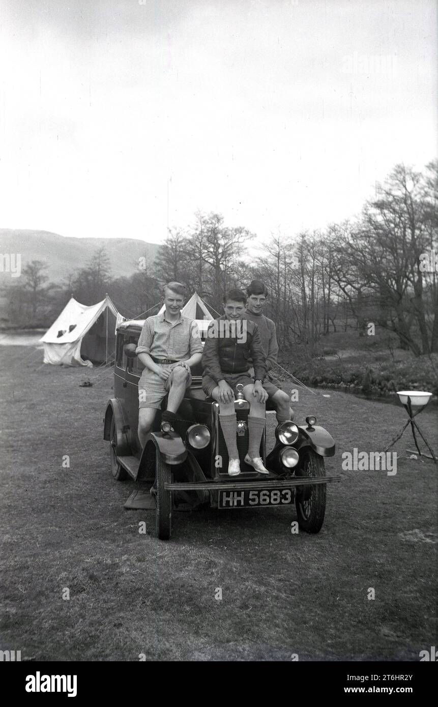 1948, historical, at camp in a country field beside a stream, three boy ...