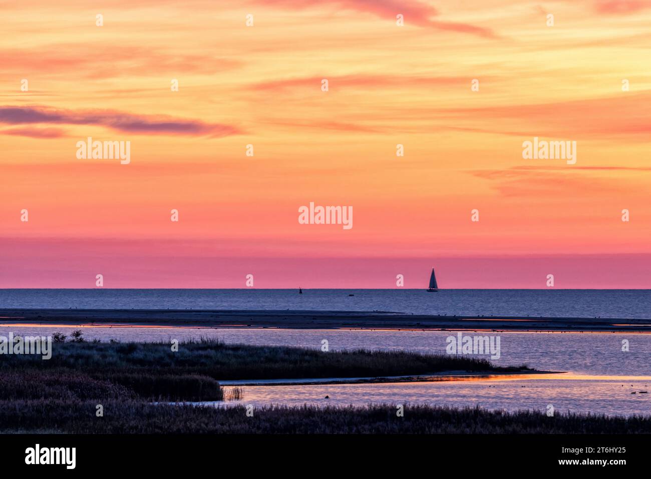 View of the Baltic Sea with dawn at the circular hiking trail Darßer ...