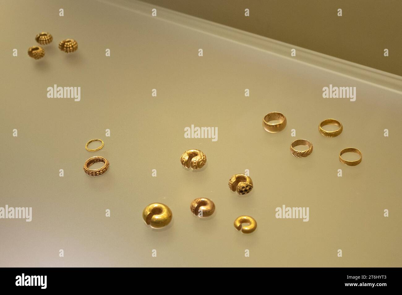 Closeup to a rounded ancient nose rings at colombian golden museum ...