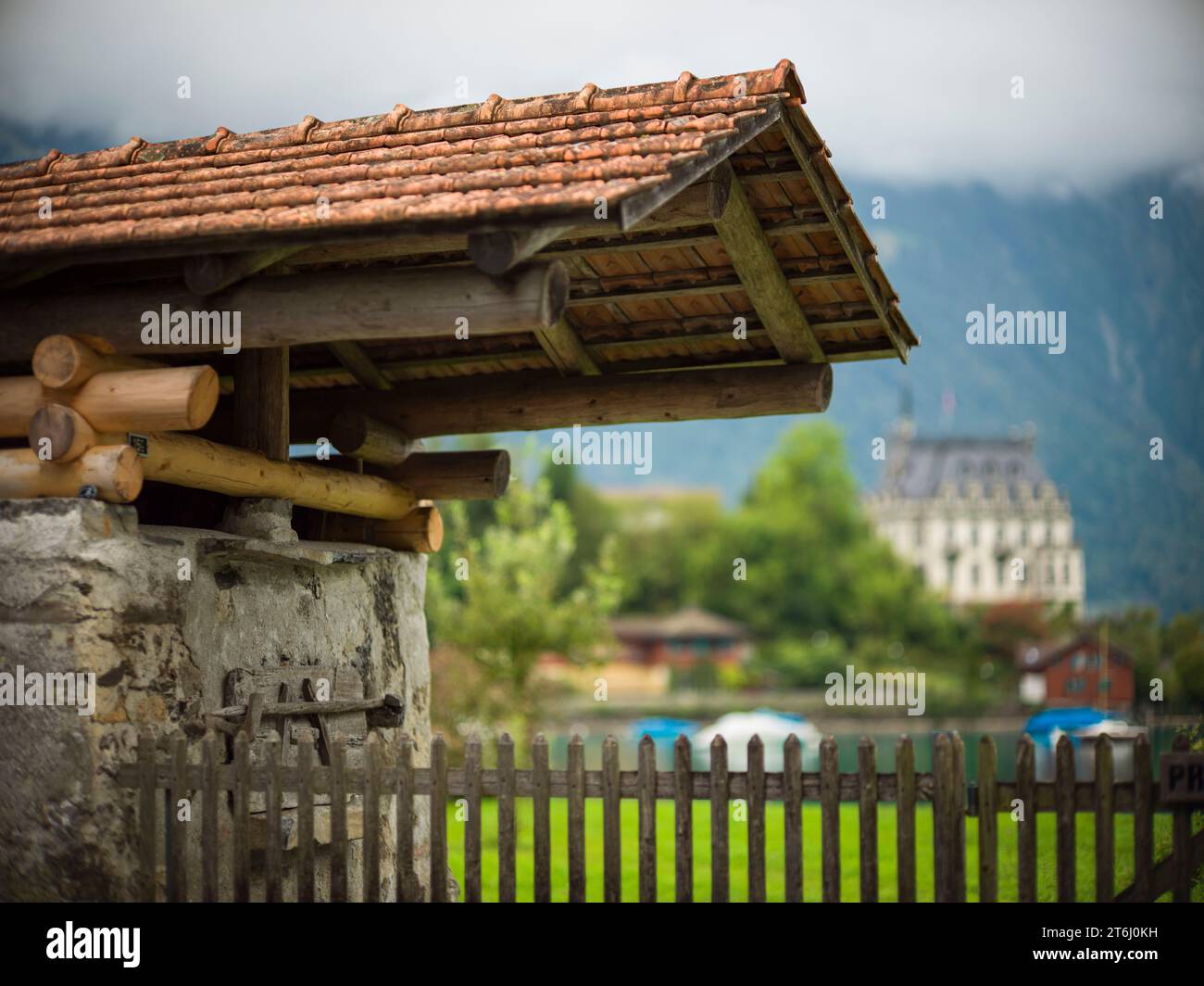 old stove and Seeburg castle out of focus in background, Iseltwald in ...
