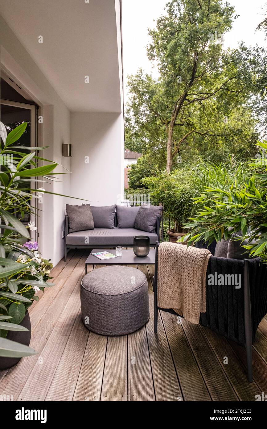 Balcony with modern lounge furniture and plants Stock Photo - Alamy