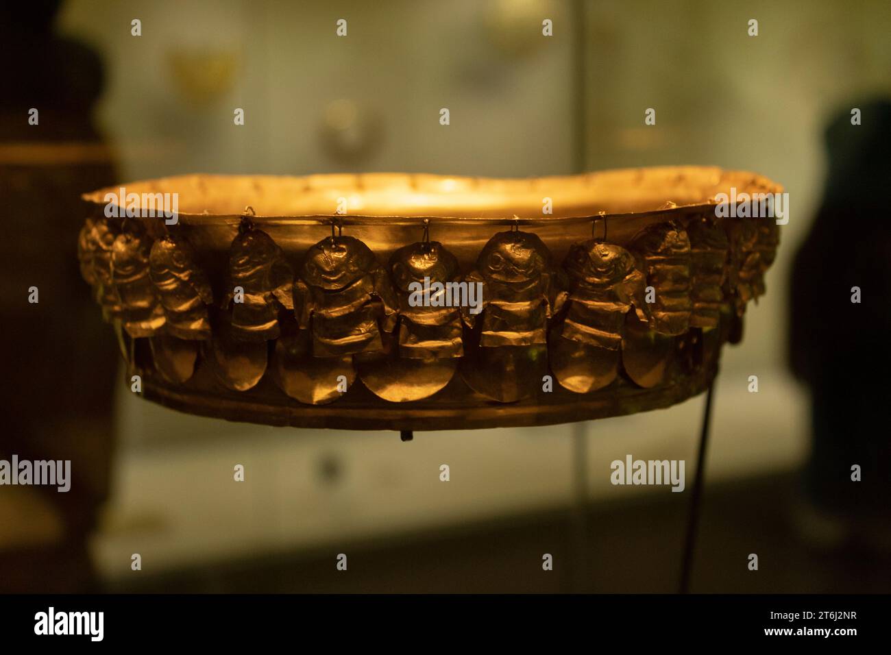 Closeup to a beautiful ancient indigenous golden crown with pendants at ...