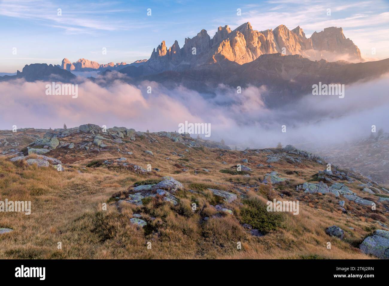 Italy, Veneto, Belluno district, Falcade, autumn sunset with low fog ...