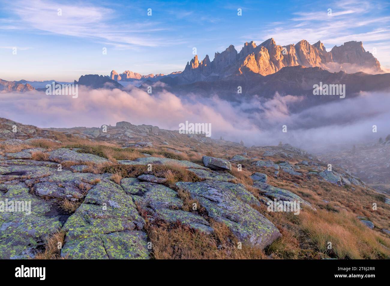 Italy, Veneto, Belluno district, Falcade, autumn sunset with low fog ...