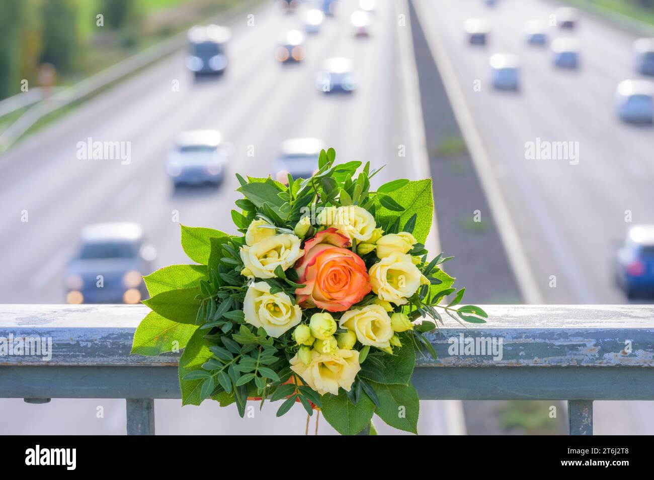 Bouquet of flowers on a highway bridge Stock Photo - Alamy