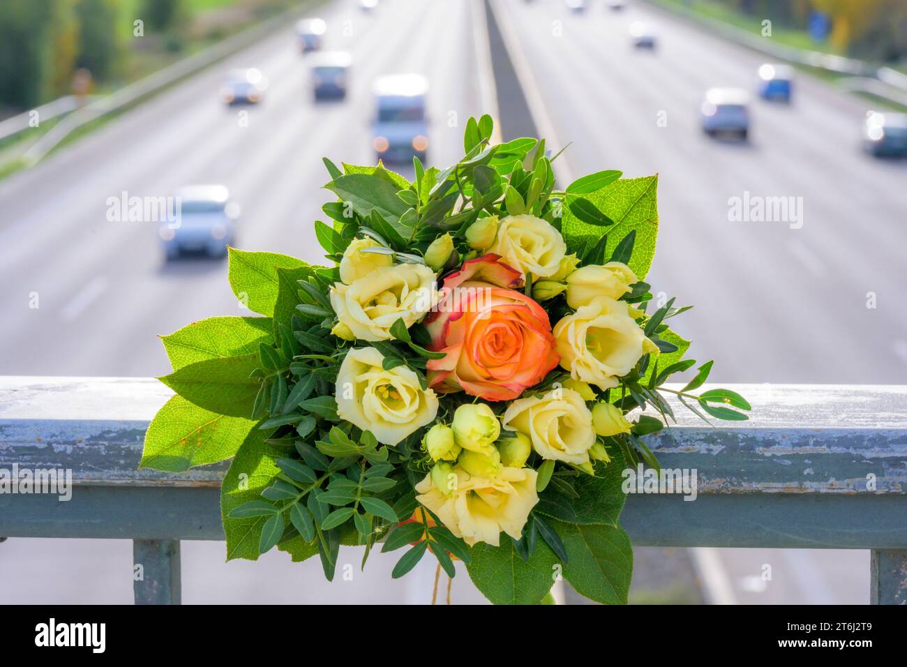 Bouquet of flowers on a highway bridge Stock Photo - Alamy