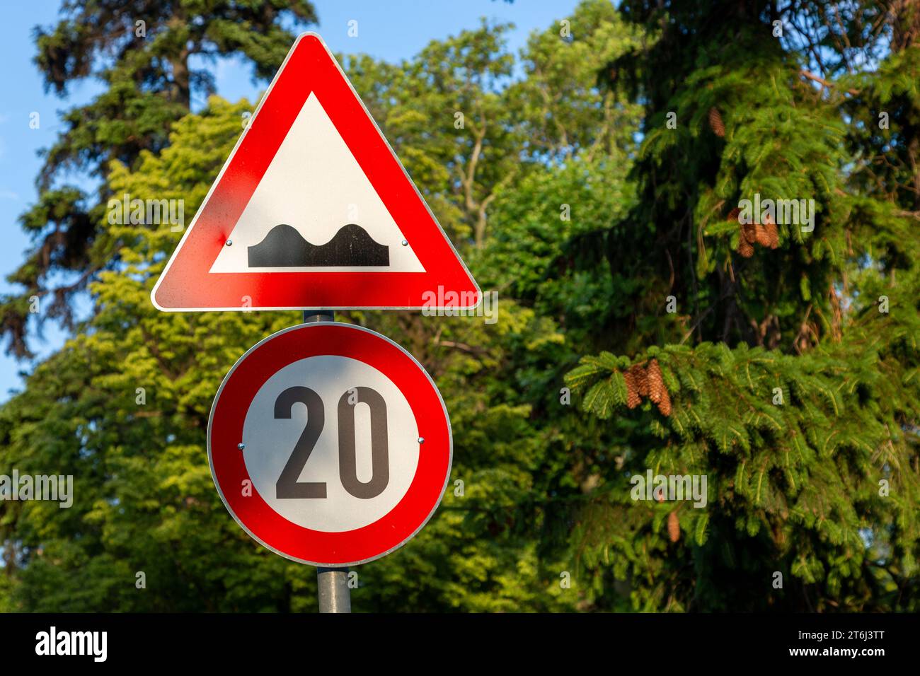Speed limit road signs and Rough road Warning Stock Photo - Alamy