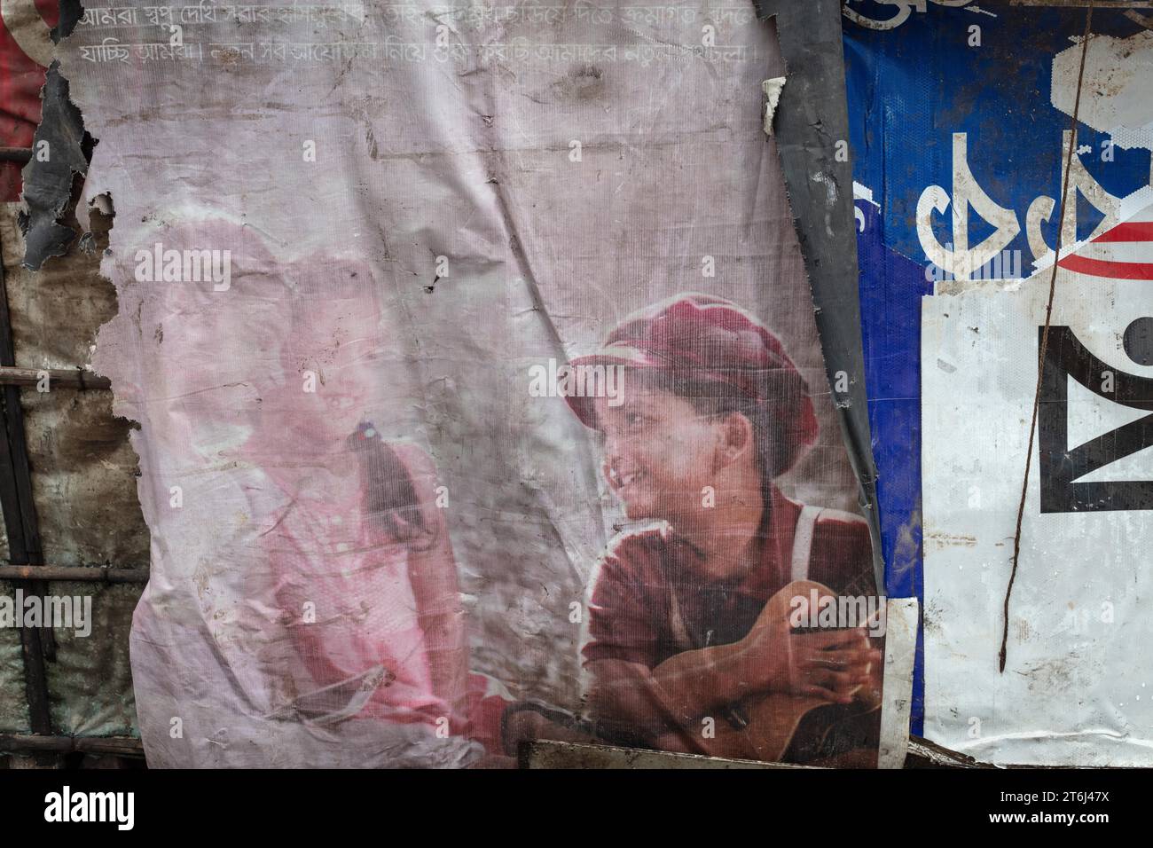 Detail of a makeshift dwelling made of plastic sheeting and bamboo ...