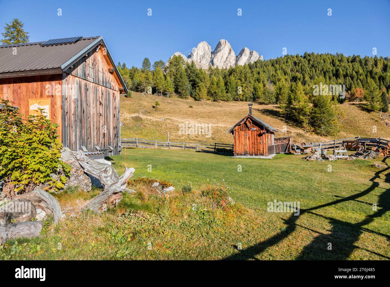 Italy, Veneto, Livinallongo del Col di Lana, pastures and wooden huts ...