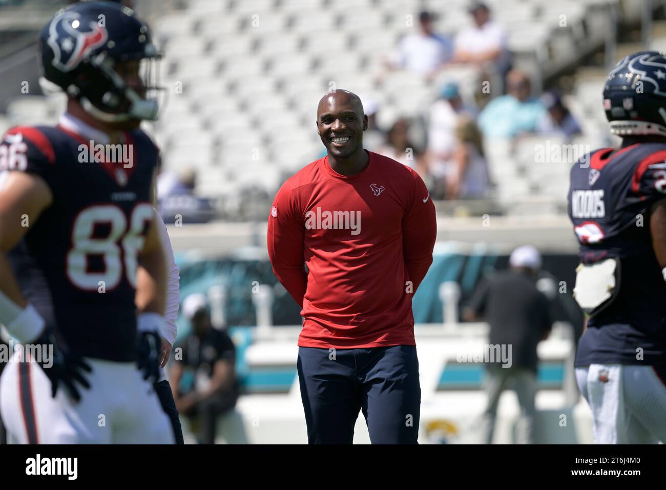 Houston Texans head coach DeMeco Ryans watches players warm up on the ...