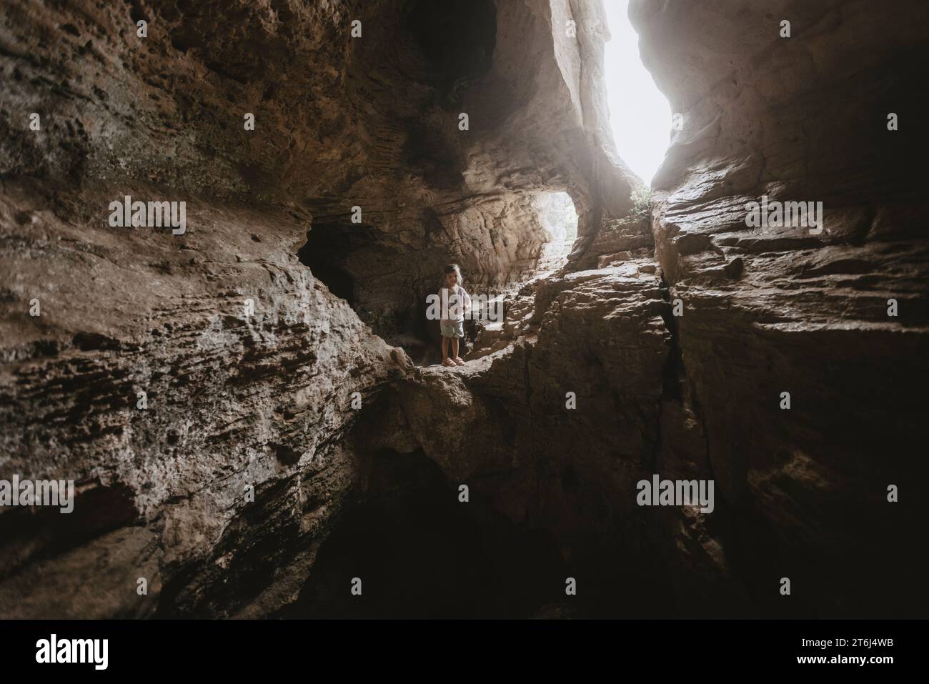 Child exploring cave hi-res stock photography and images - Alamy