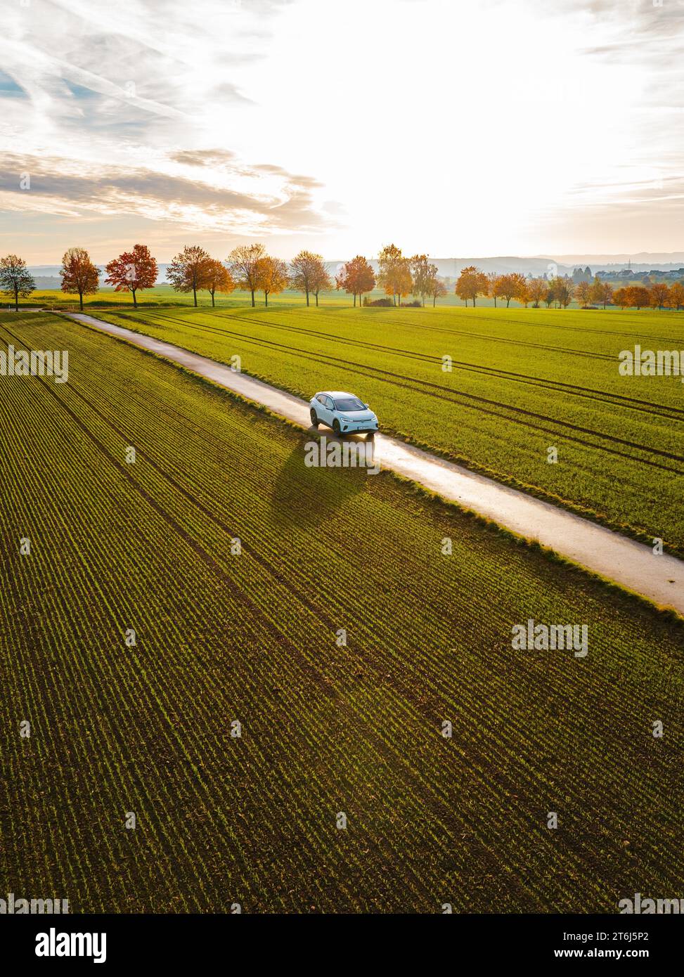 Aerial view of a VW ID4 electric car at sunrise in autumn, Herrenberg ...
