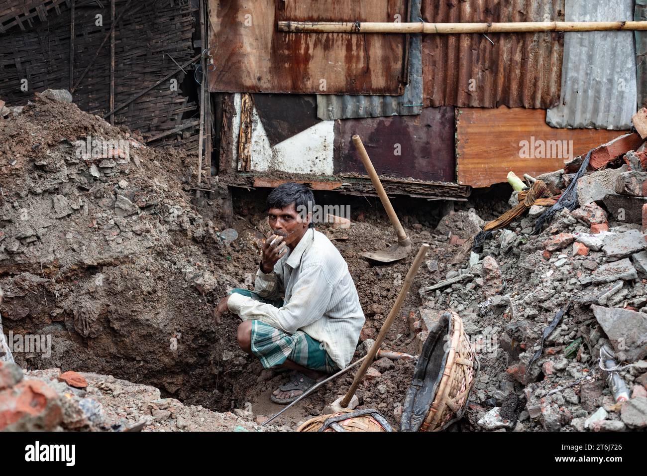 Construction workers during a break, Tejgaon Slum Area, Dhaka ...