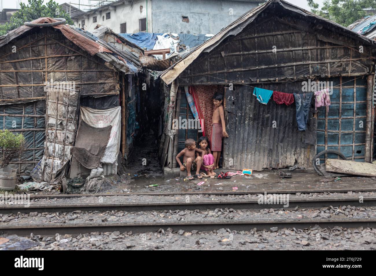 Children in front of their house, which was built right next to the ...