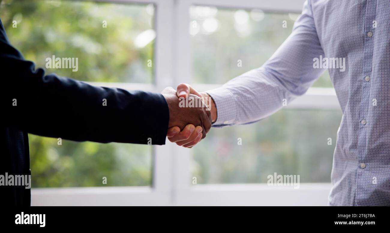 African Man Handshake With Partner. Deal Approval Stock Photo - Alamy