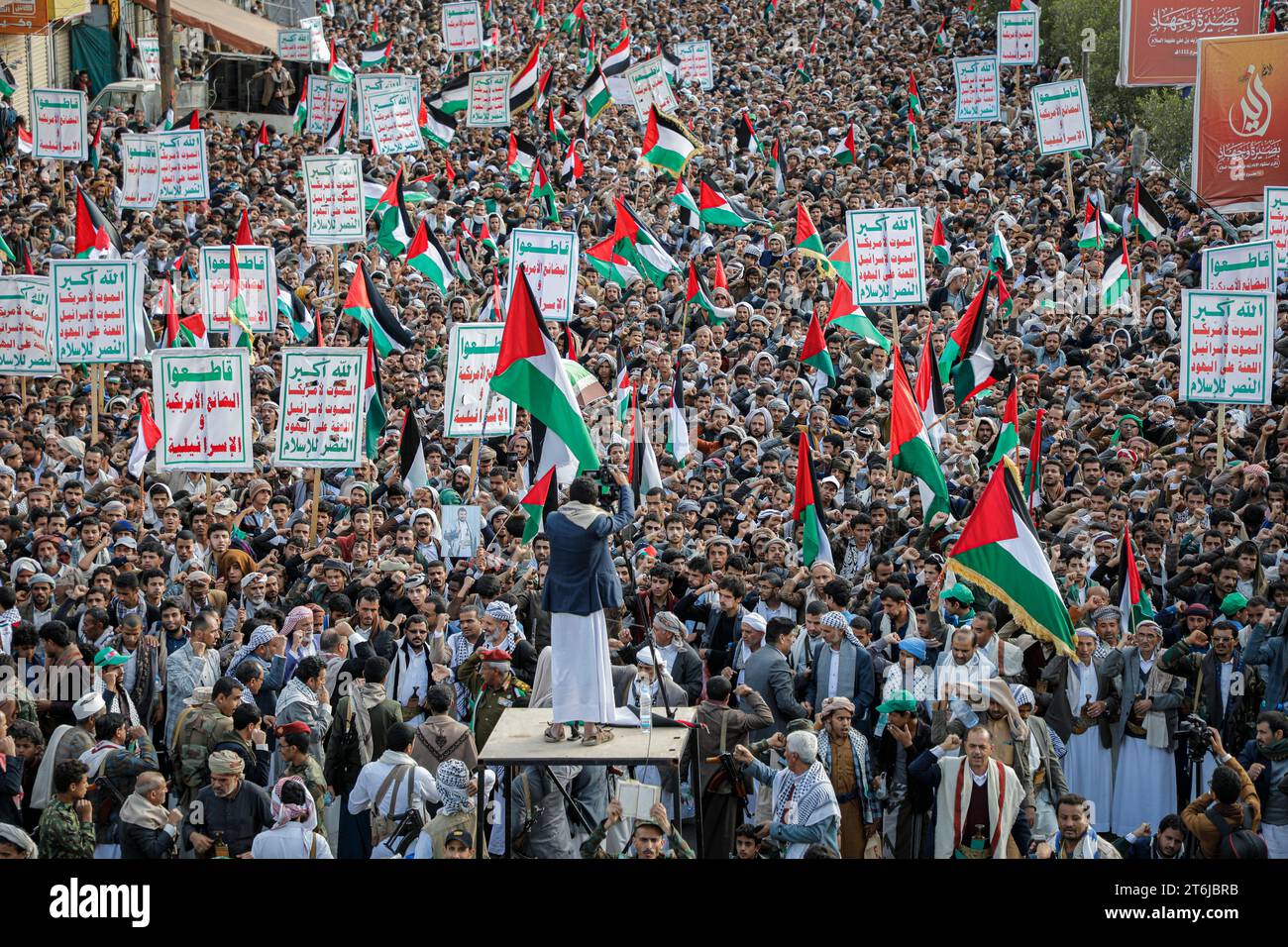 10 November 2023, Yemen, Sana'a: Yemeni protesters chant slogans and ...